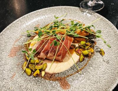 Jake Lawler of Vintage Brewing Co. makes prosciutto-wrapped pork ...