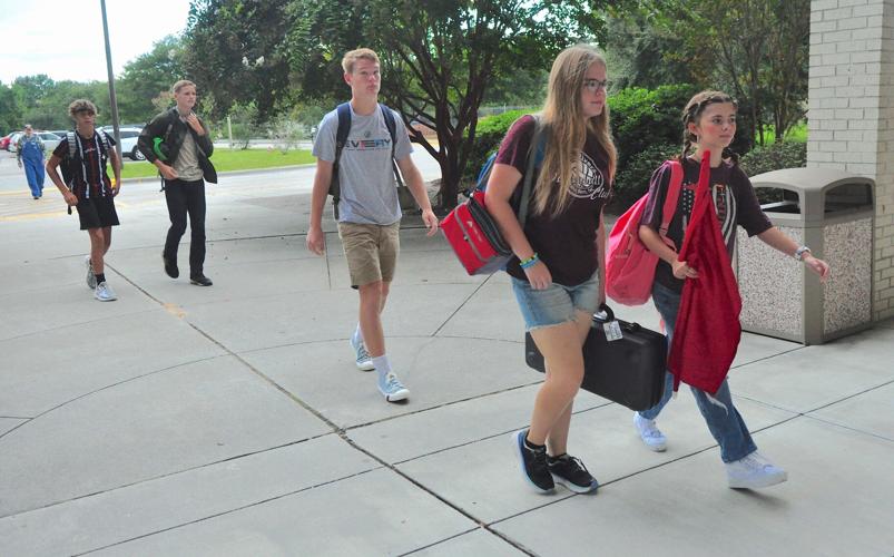 GALLERY: County students report mask free to classes, welcomed by SROs ...