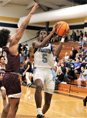 East boys make it to third round again, escape with 61-60 win over ...