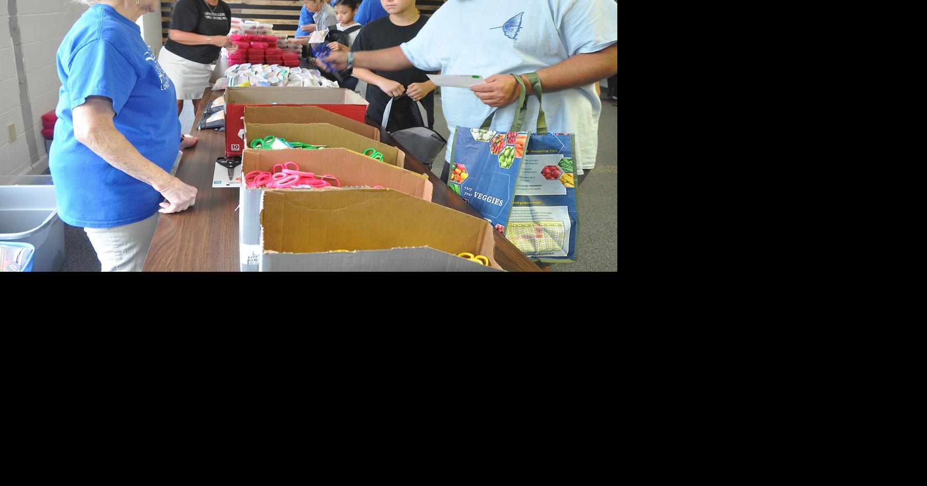 Families receive free school supplies during Stuff the Bus | News ...