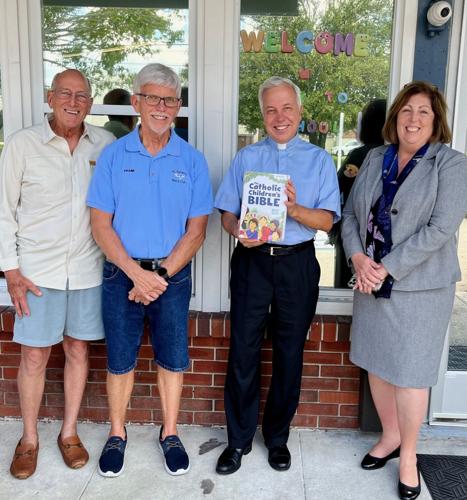 Men’s group donates Bibles to St. Egbert Catholic School | News ...