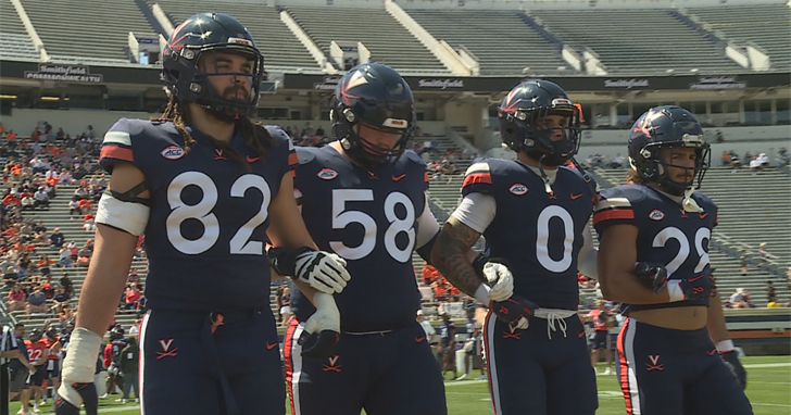UVA football team gets boost from local students on their way to the ...