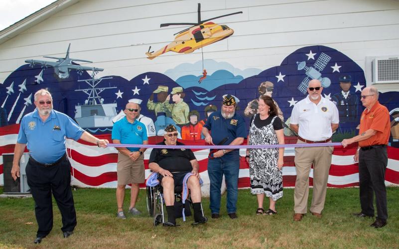 Artist paints military-themed mural on American Legion | Regional ...
