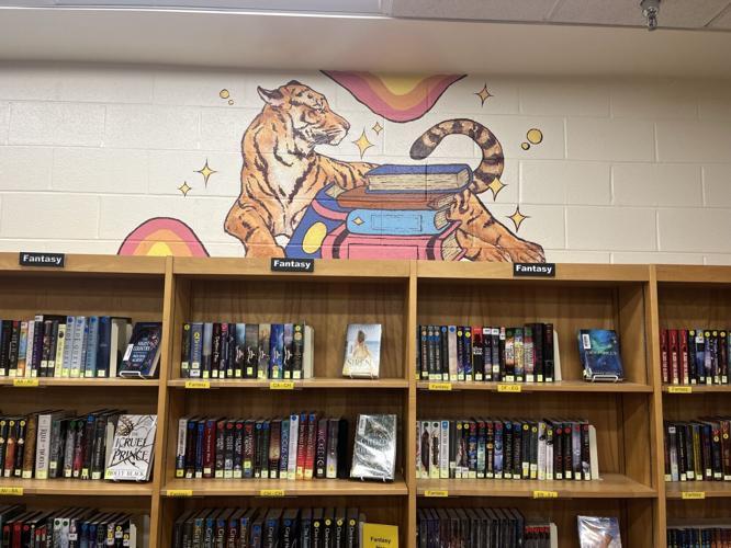 Rising Sun High student shares love of art through library mural ...