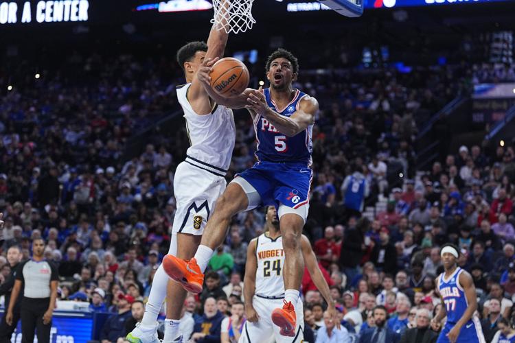 Brown's goaltended layup in OT lifts short-handed Nuggets over 76ers ...