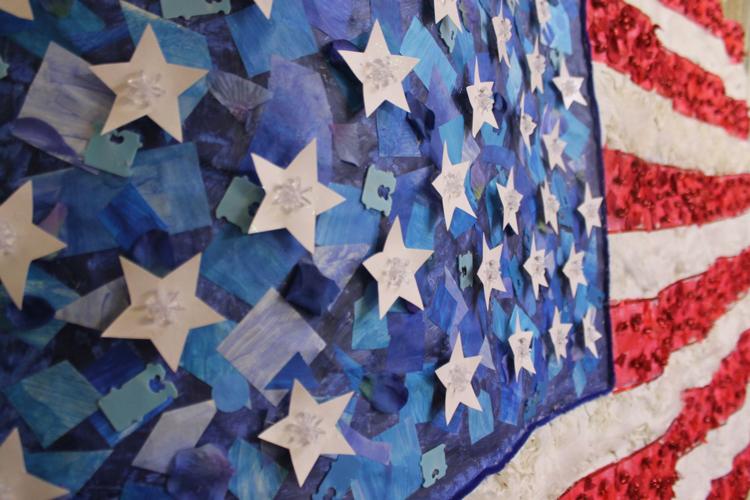 Bayside Community Network crafts flag out of recycled materials | Local ...