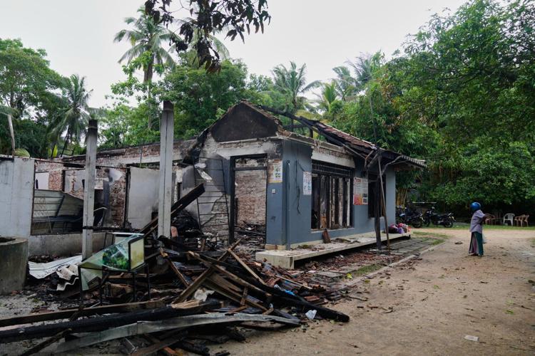 Survivors from a burned Sri Lankan nursing home relocate, in photos ...