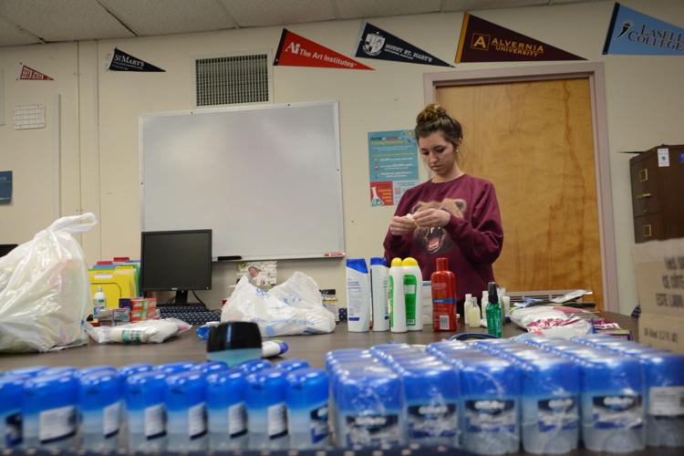 North East High students prepare personal care bags for homeless ...