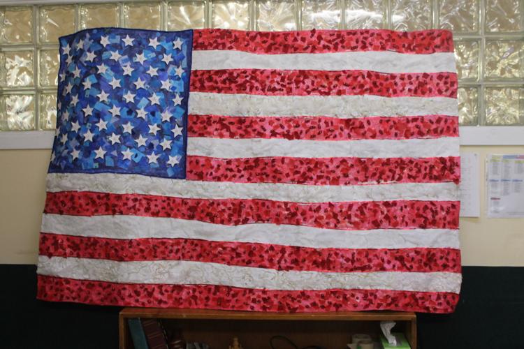 Bayside Community Network crafts flag out of recycled materials | Local ...