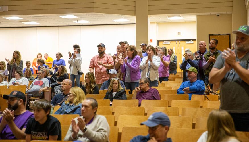 Dozens speak in support of Board of Education member after ...