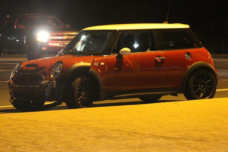 Car lands in intersection median after collision on Bluff Street ...