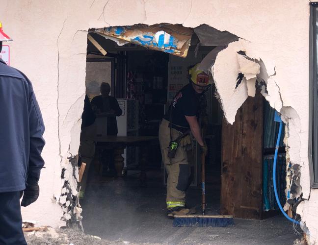 Merchandise, debris scatter in all directions when SUV crashes into ...