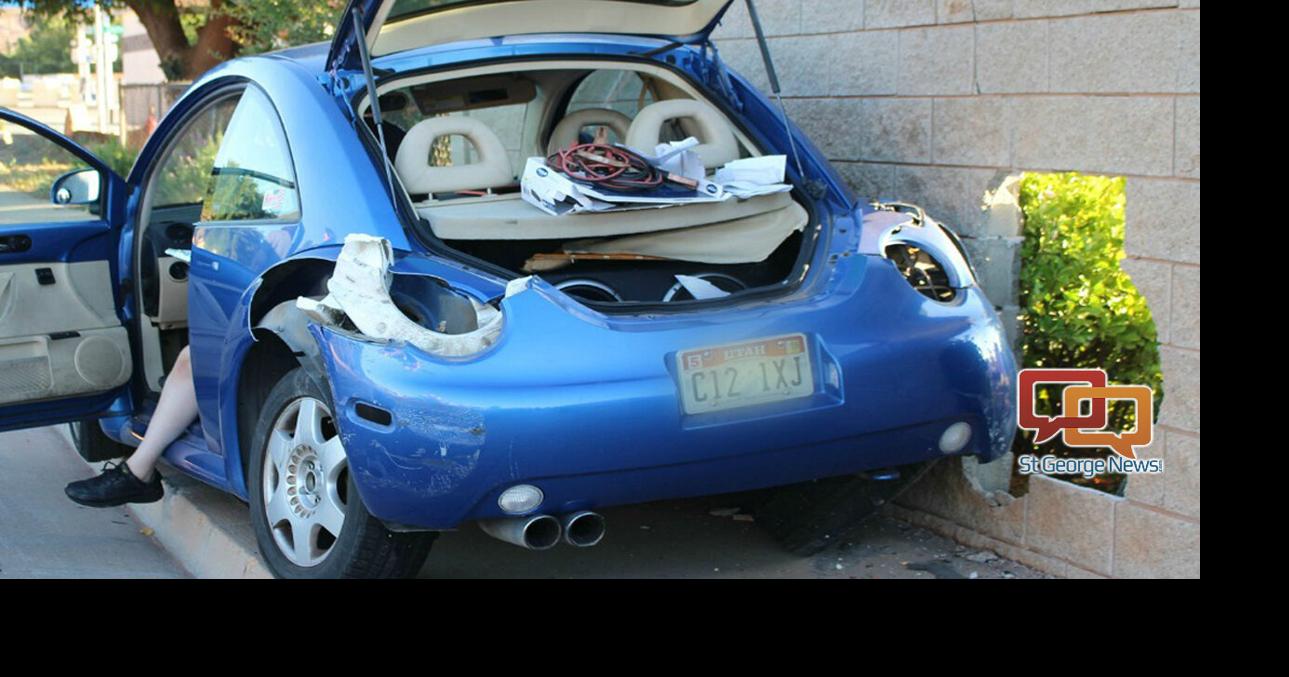 2-vehicle crash ends with Volkswagen Beetle smashed into retaining wall ...