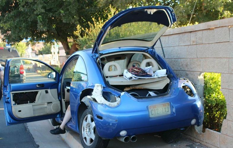 2-vehicle crash ends with Volkswagen Beetle smashed into retaining wall ...