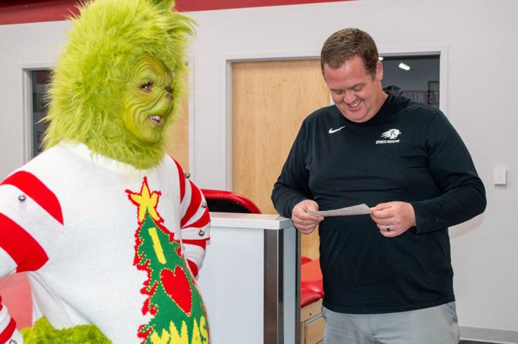 Not so mean after all, the Grinch visits Southern Utah schools, hands ...