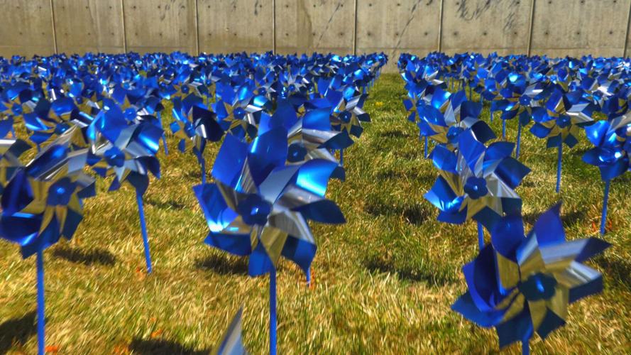 Pinwheels line lawns at Primary Children’s Hospital to honor 1,800 youth lost to child abuse in ...