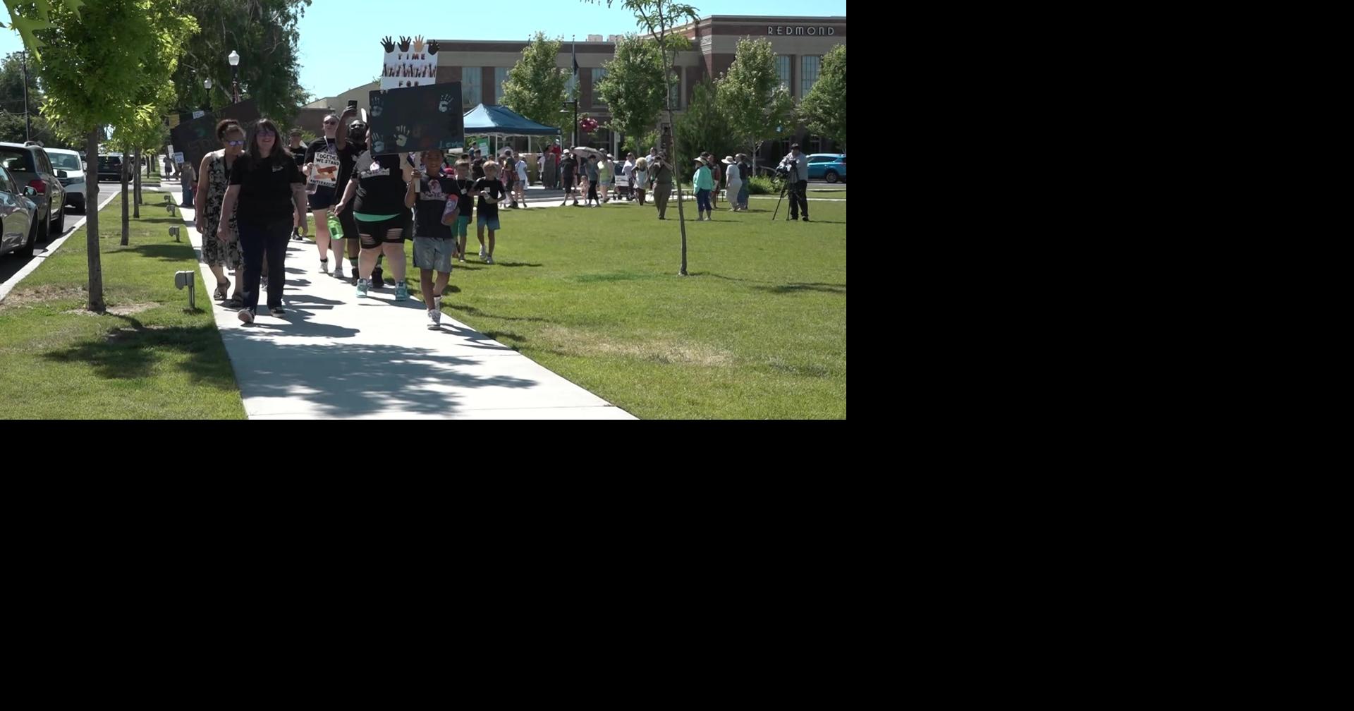 10-year-old Gavin Alston, Redmond Councilor Evelyn rally against racism ...