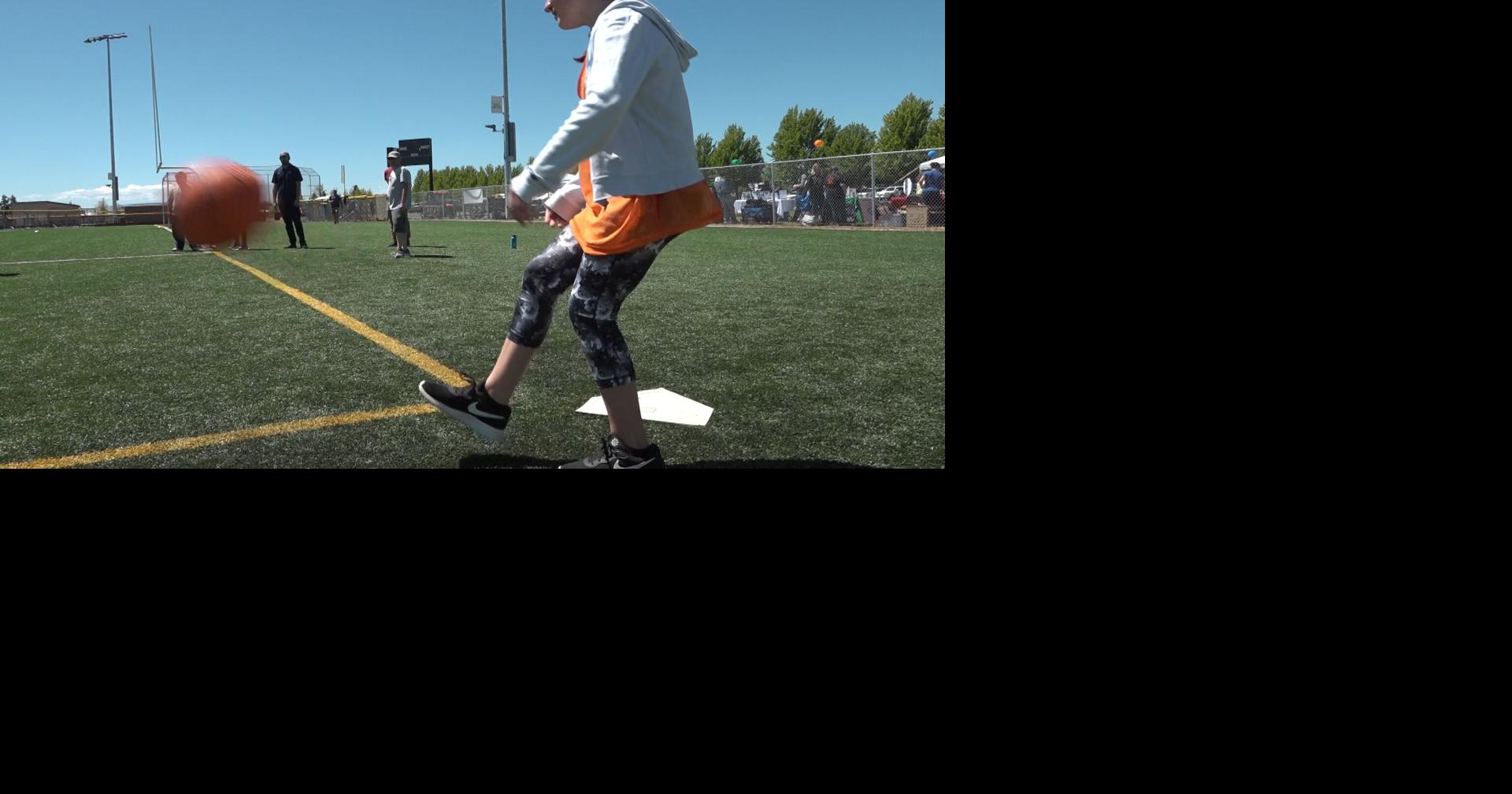 Unified kickball teams special needs athletes with helpers | Redmond ...