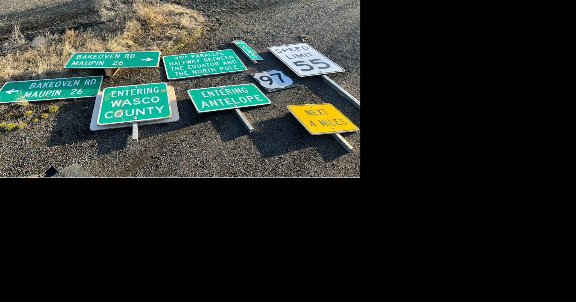 Oregon 45th parallel sign among several vandalized road signs in Wasco ...