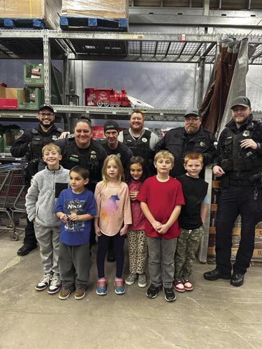 Children pair up with Chetek PD during Shop with a Cop event ...