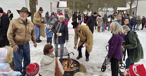 Dashing through the snow on a two-horse open sleigh at Pioneer Village ...