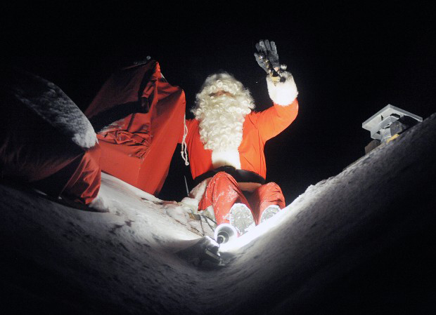 Whimsical rooftop Santa is ready to hand off his duties