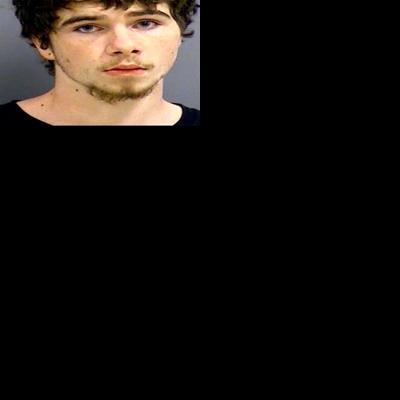 Wooley charged with threatening police officer