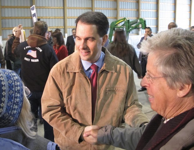 Walker campaigns as Democrats file election papers