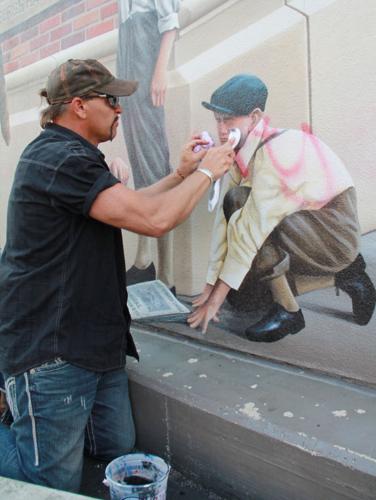 Artist begins repair of Pumpkin Show mural | News | circlevilleherald.com