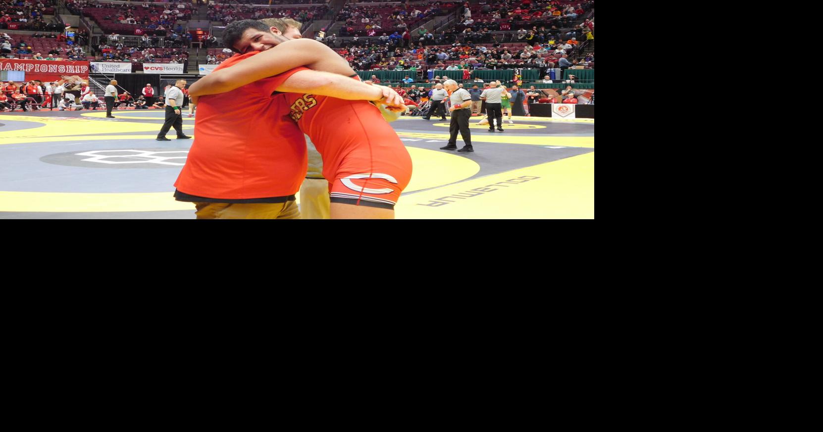 Fulgham big smile while hugging coach | Sports | circlevilleherald.com