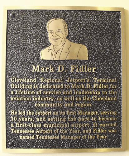 Plaque dedicates jetport terminal to Fidler | News | clevelandbanner.com