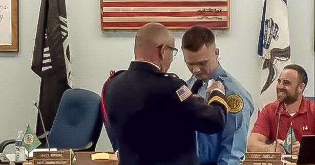 Moss sworn in as Clinton firefighter | News | clintonherald.com