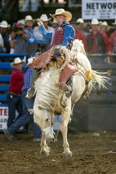 Wright bests four brothers to win saddle bronc in opening rodeo ...