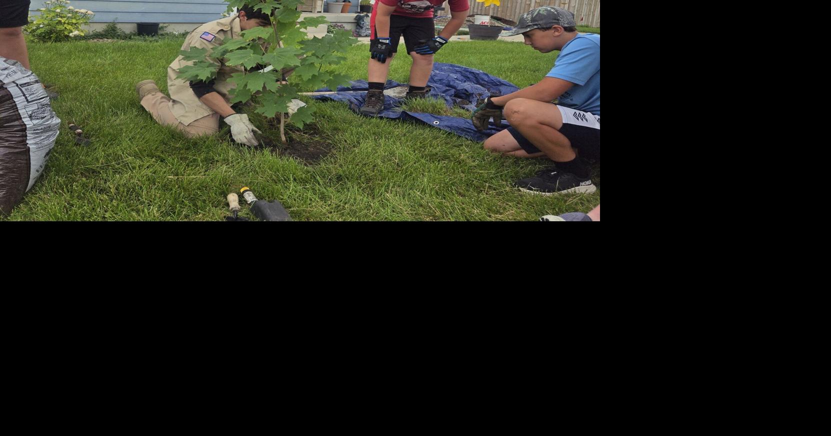 Eagle Scout Nathaniel Navarrete plants trees for Habitat