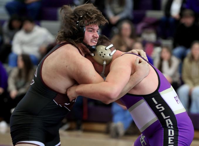Discoverers wrestling defeats Grand Island, girls medal two at Winnebago