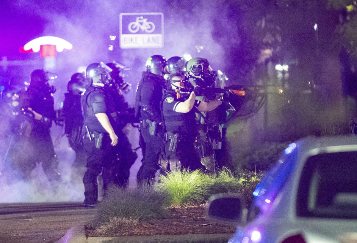 Watch Now: State trooper kneels with protesters marching for George ...