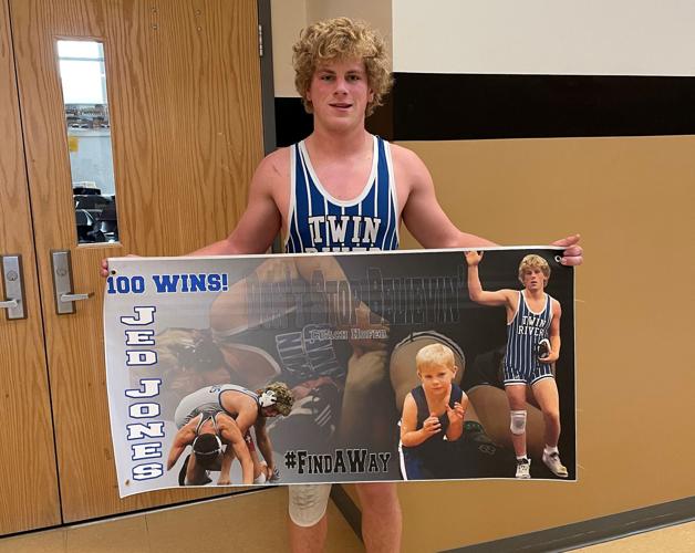 Jones reaches 100, four Titans collect hardware at Aquinas Invite