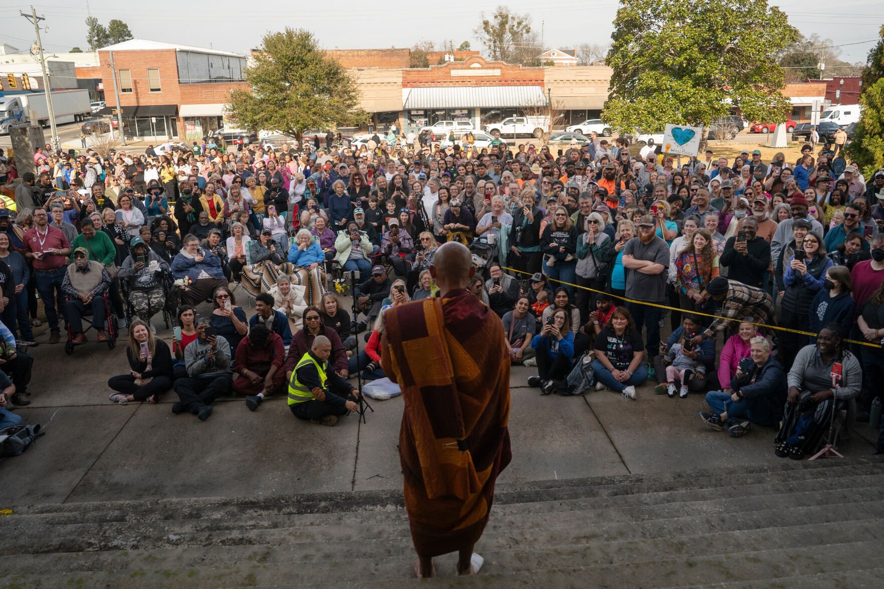 Buddhist monks and dog captivate Americans on walk for peace
