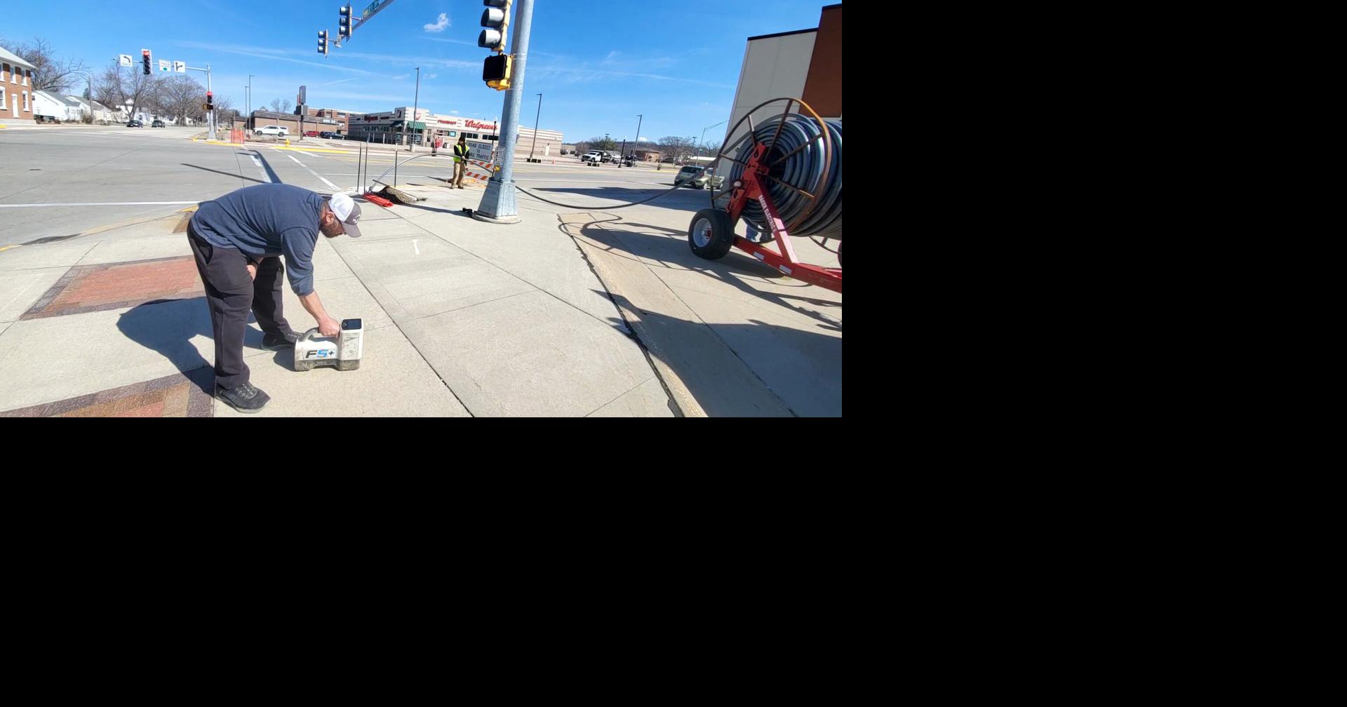 Workers run conduit for new red light traffic cameras | Local ...