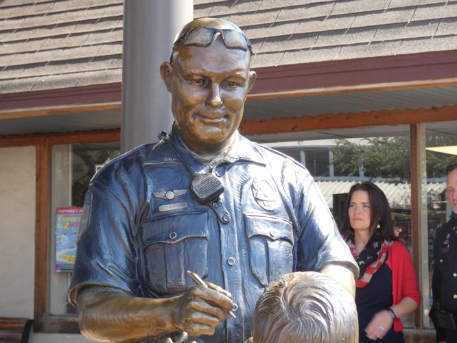 Thompson bronze statue unveiled: Ceremony honors fallen officer | News ...