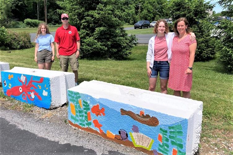 Artists paint murals on Simpson Library parking lot barriers in ...