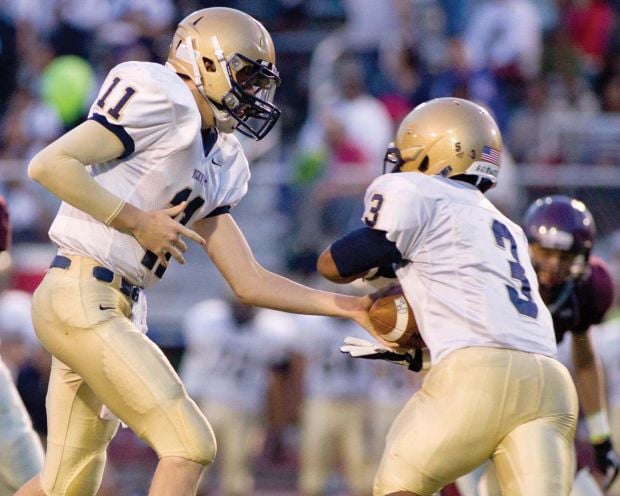 Football: Bishop McDevitt rolls past a dinged-up Mechanicsburg