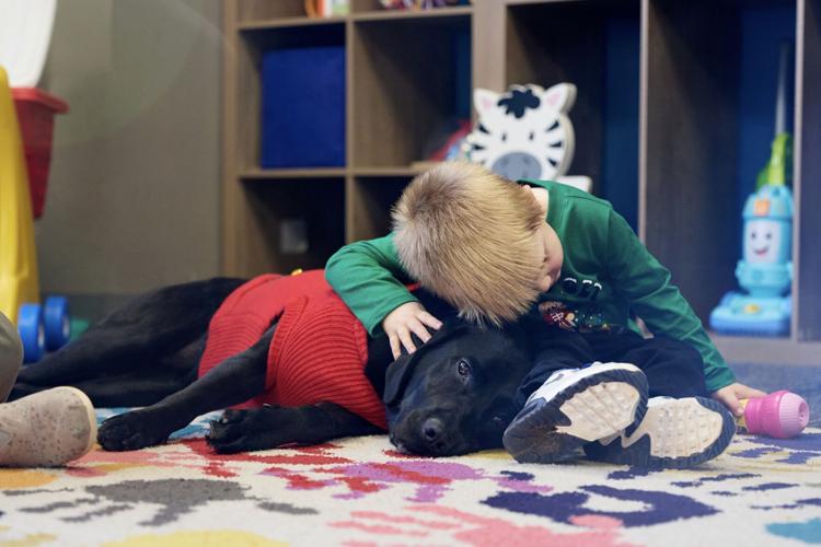 ‘Indescribable honor’: Bryan’s therapy dog brings joy to children with ...
