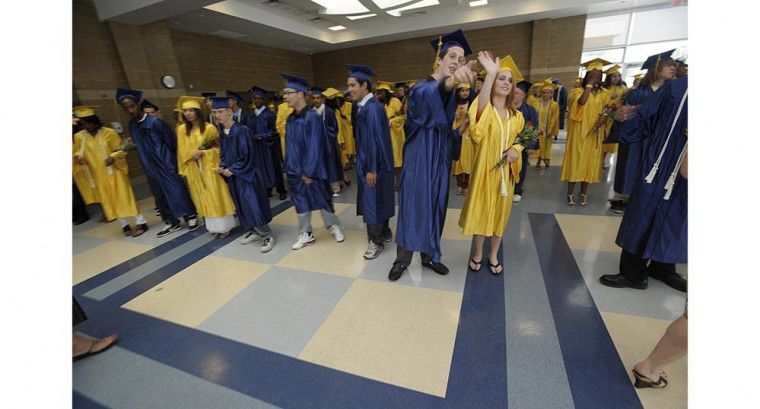 Hudson High exhibits 'Bluehawk pride' on graduation day ...