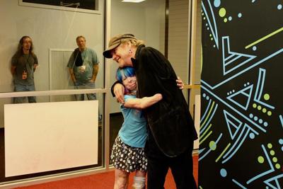 Schenectady arson survivor Safyre shares hug with Def Leppard’s Rick ...