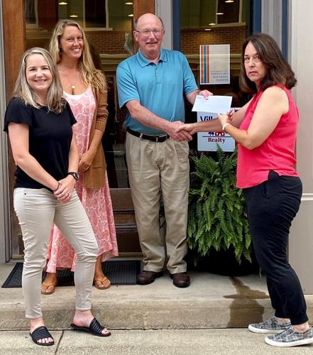 Villager Realty donates to food bank | | dailyitem.com