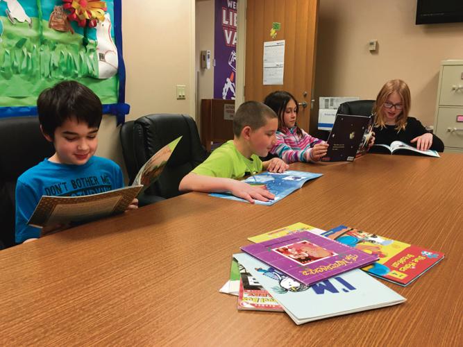 Reading program helps kids learn: Librarian, student mentors foster ...