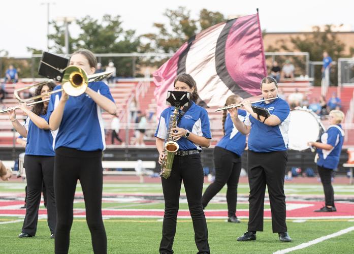 Warrior Run Marching Band director encourages spectators to bust a move ...