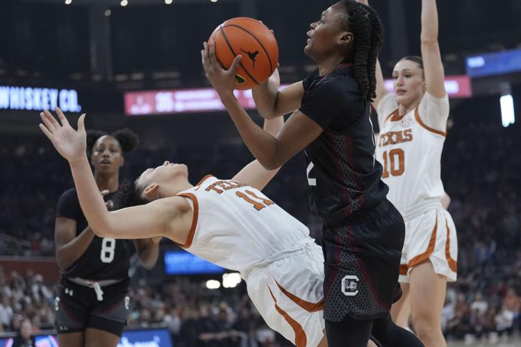 Texas knocks off No. 2 South Carolina to forge 3-way tie atop SEC standings By MARK ROSNER ...