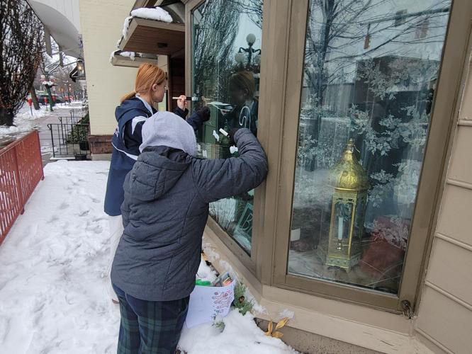 Lewisburg art students paint Market Street with winter-themed murals ...
